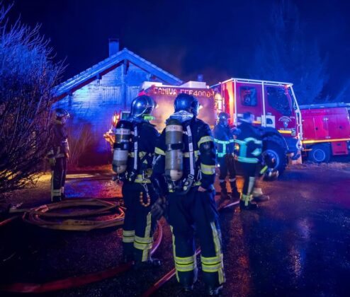 A building evacuated following a fire, a woman and an infant ...
